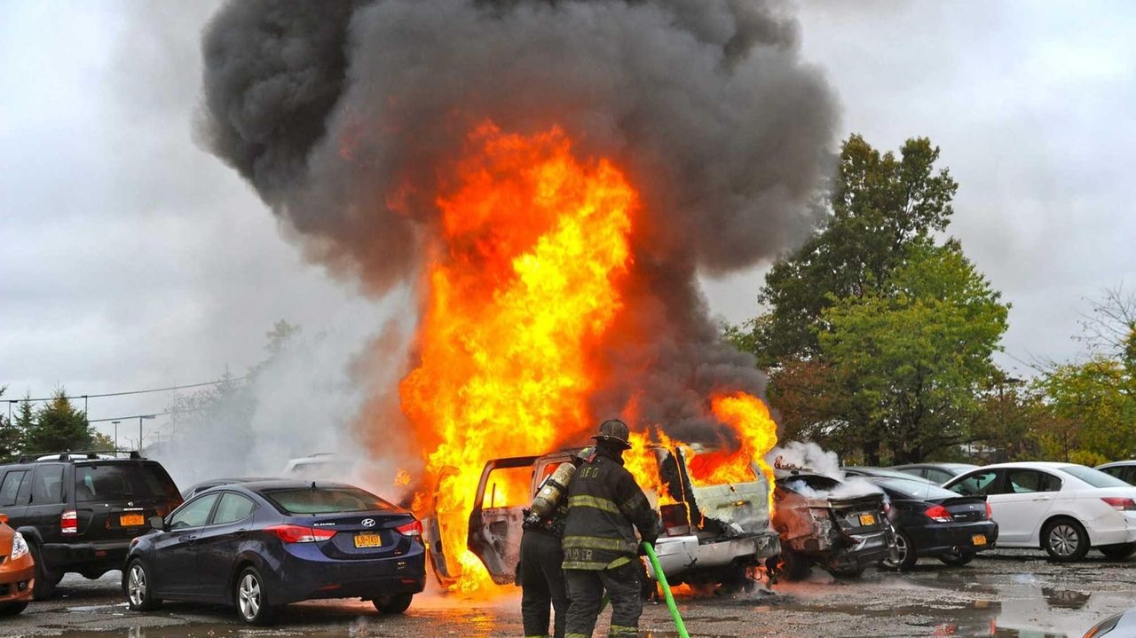 Car fire in lot behind Museum Row in East Garden City appears to be ...