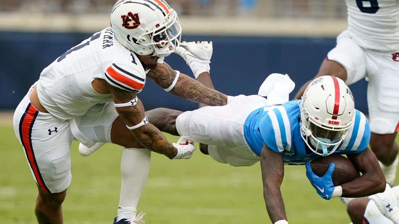 No. 9 Mississippi runs wild and holds off Auburn 48-34 - Newsday