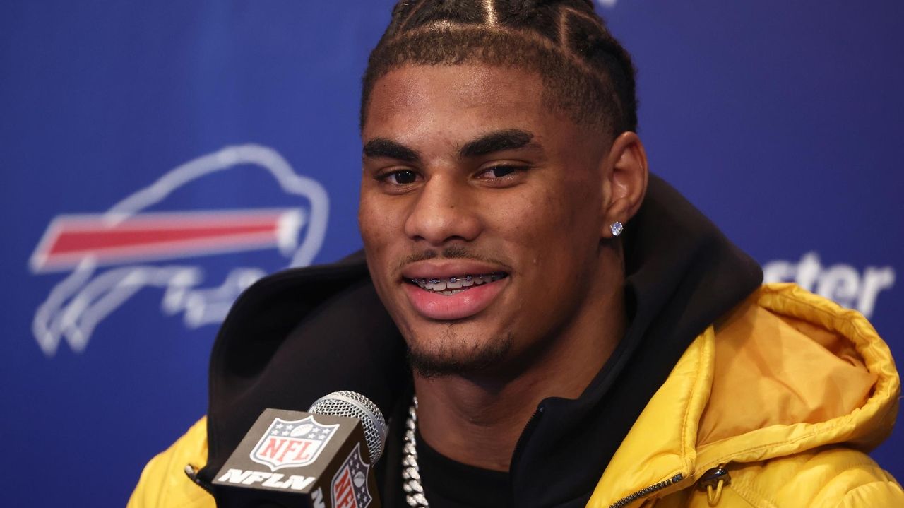 Rookie Keon Coleman playfully embraces Buffalo while showing a serious ...