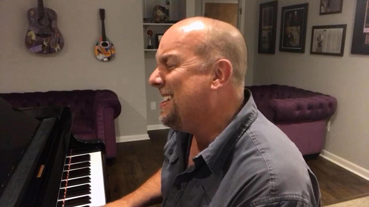 David Clark, lead singer of Songs in the Attic, performs 'Vienna' - Newsday