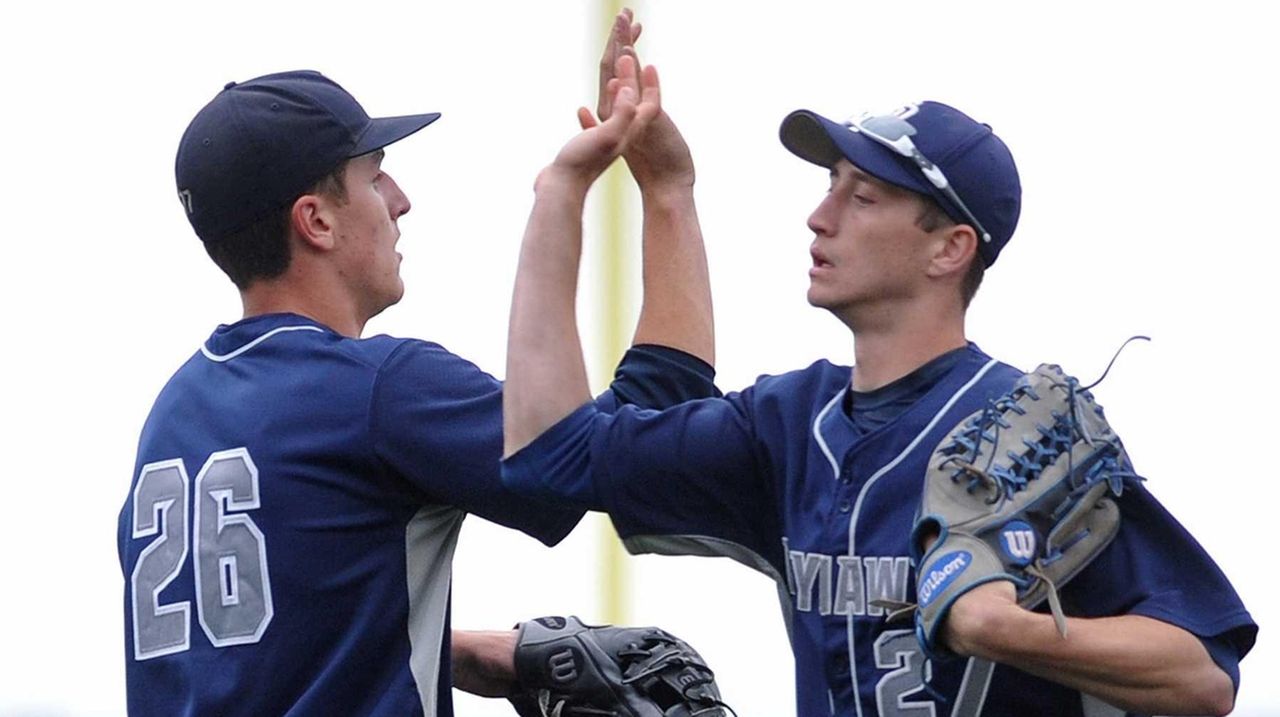 St. Dominic centerfielder John LaRocca throws out runner at plate to ...