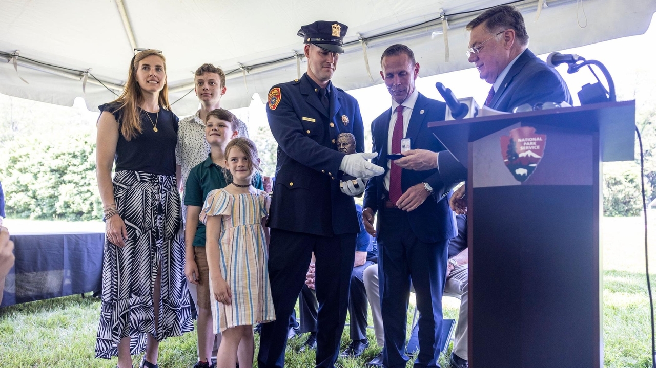 Suffolk Det. Timothy Thrane and Nassau Officer Alexa Crimaudo receive ...
