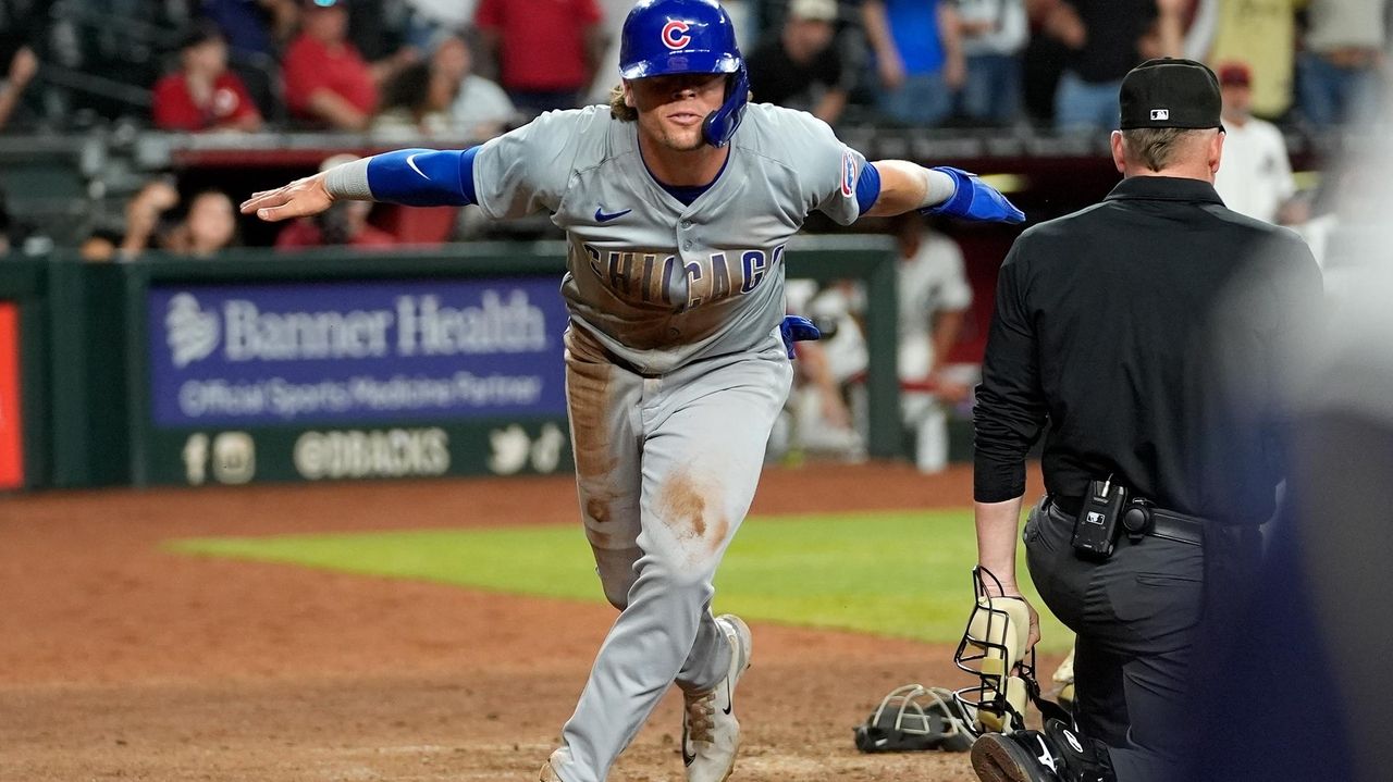 Nico Hoerner's tying dash and go-ahead single rally Cubs past Diamondbacks 3-2 in 11 innings ...