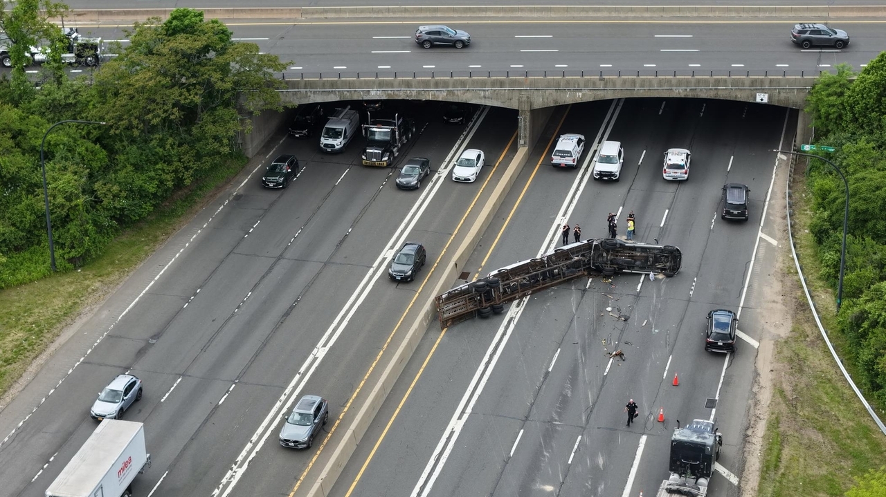 Car carrier overturns on LIE near Syosset, backing up westbound traffic ...