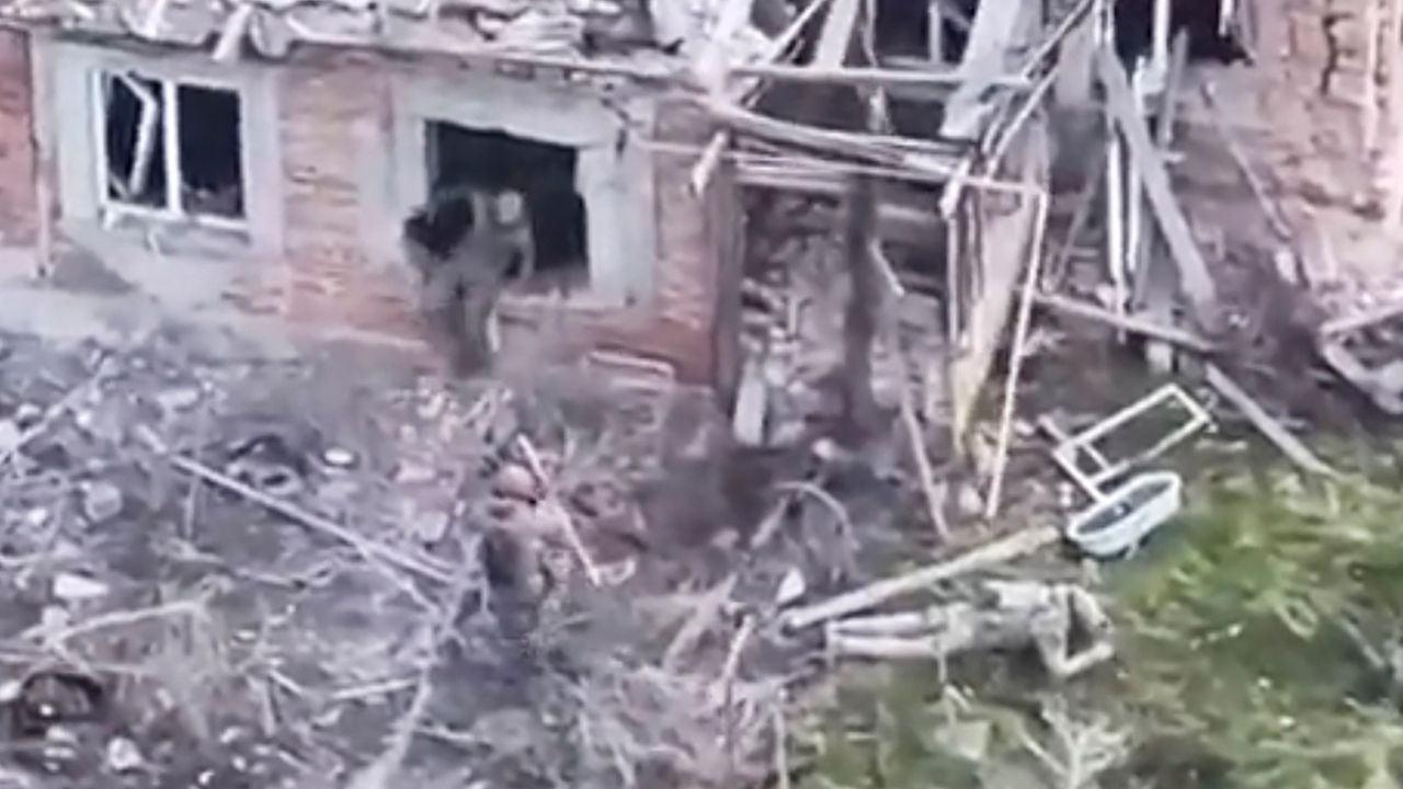A video shows men identified as Russian troops holding Ukrainian POWs ...