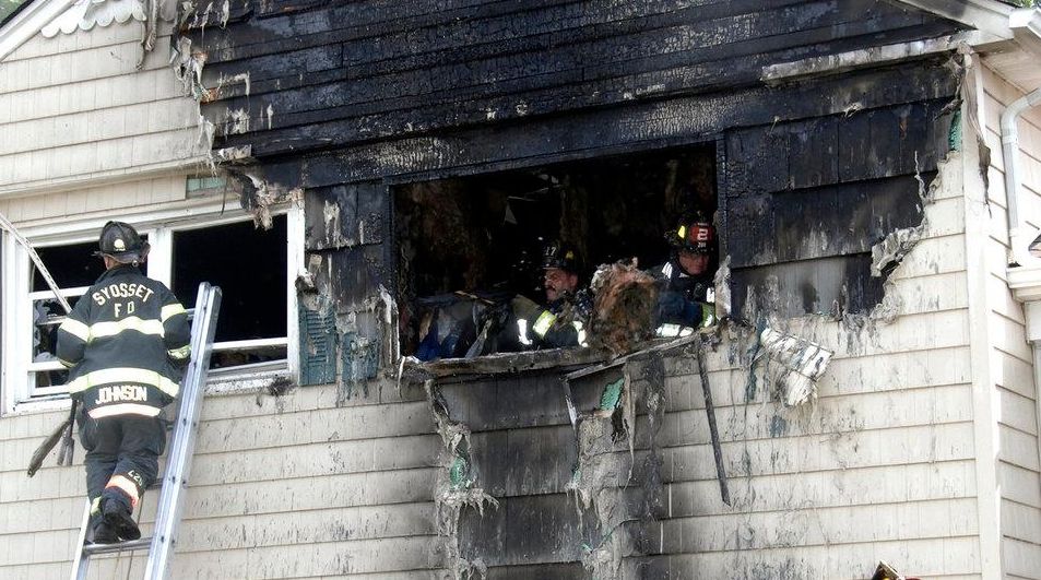 Syosset home damaged in blaze; firefighters rescue family cat - Newsday