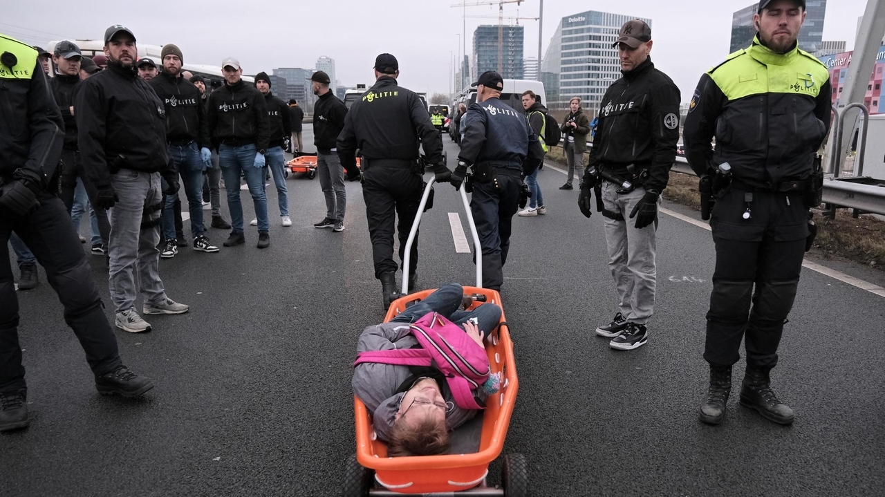 Climate activists from Extinction Rebellion target bank and block part ...
