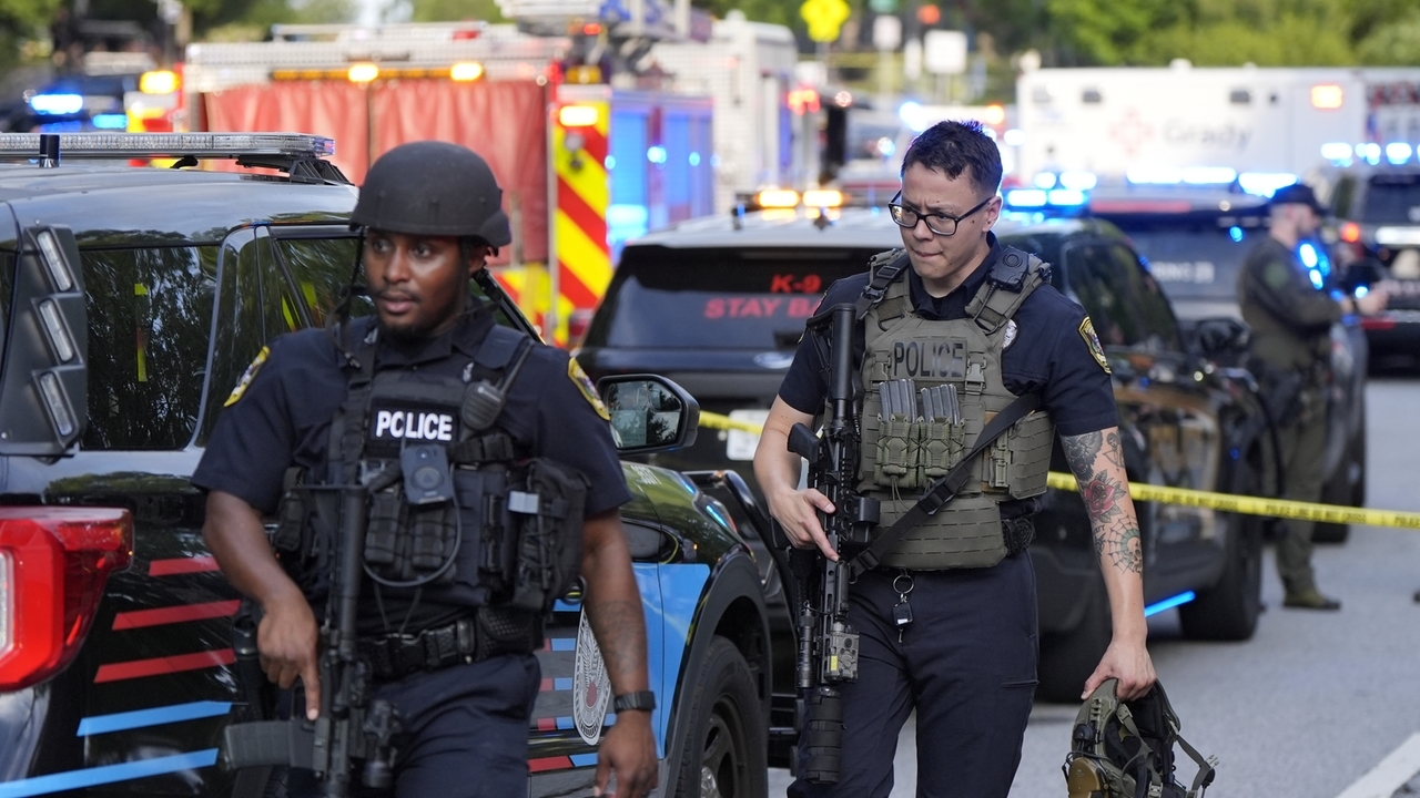 Suspected gunman and police officer dead in shooting near the CDC and ...