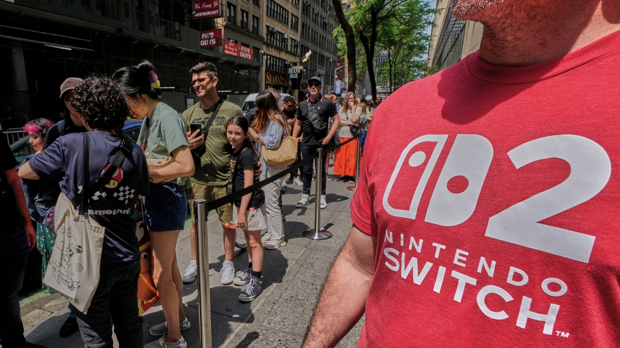 Fans around the world queue up in long lines for the highly anticipated ...
