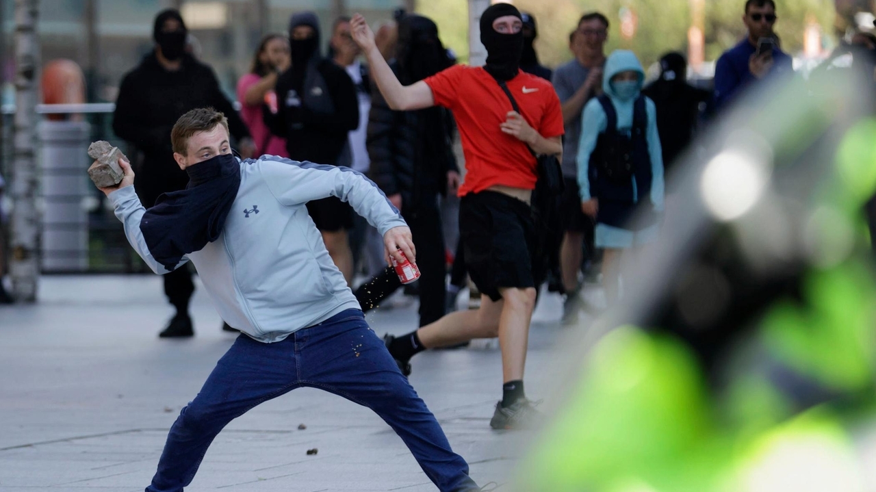 Police officers injured as far-right activists face off against anti ...