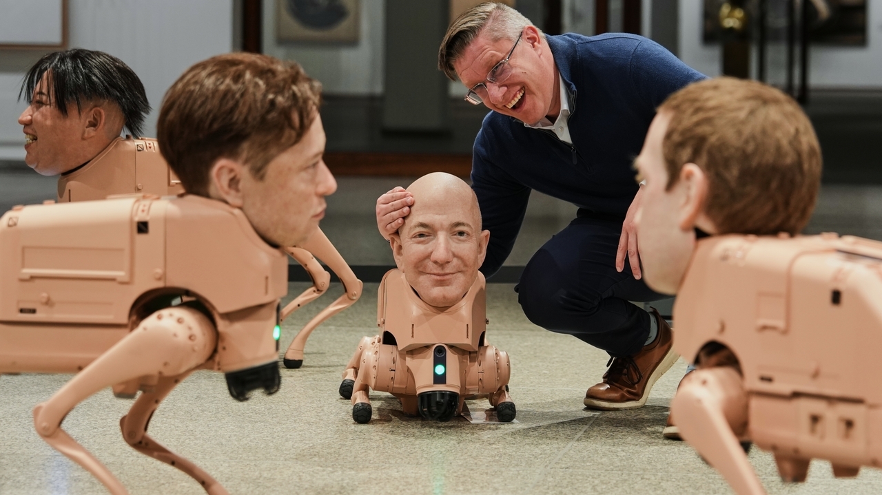Robot dogs with Musk and Zuckerberg heads roam around Berlin gallery in ...