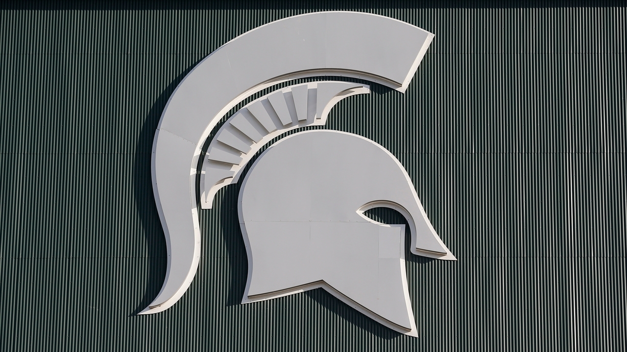 Former Michigan State player and director of hockey operations Dan ...