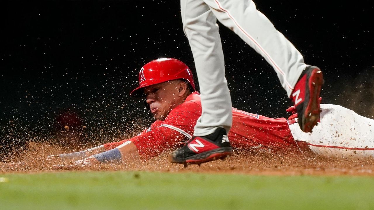 Angels score two on wild pitch and throwing error, beat Phillies 6-5 ...