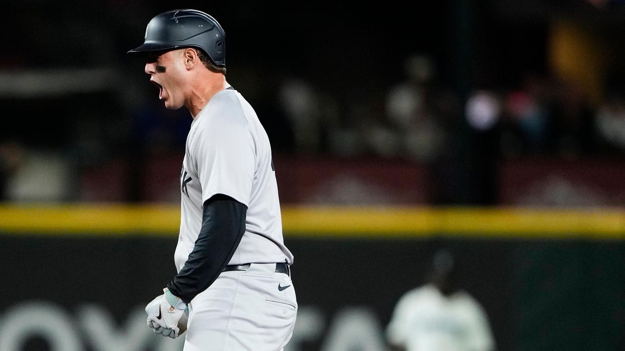 Yankees clinch playoff berth with victory over Mariners in 10 innings ...