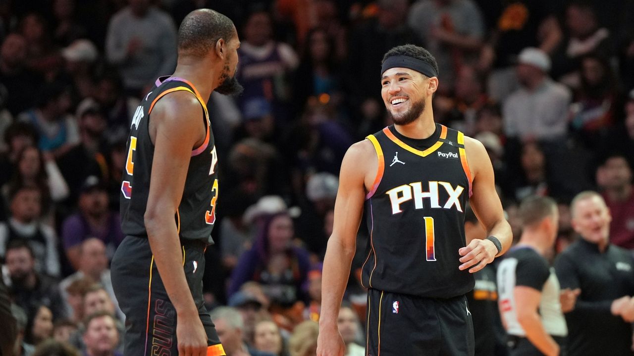 Booker scores 29 and Suns lose Durant to ankle injury in 104-93 win over Spurs - Newsday
