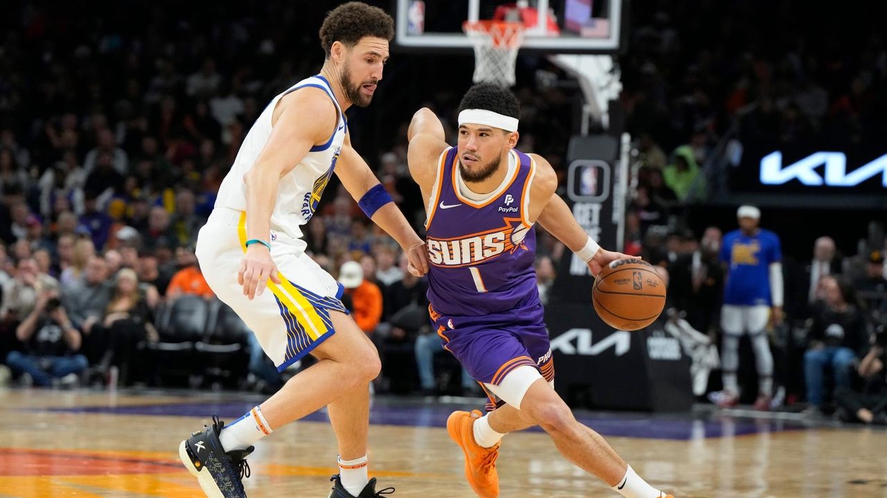 Booker scores 32, Suns hang on late to beat Warriors 119-116 on night Draymond Green ejected ...