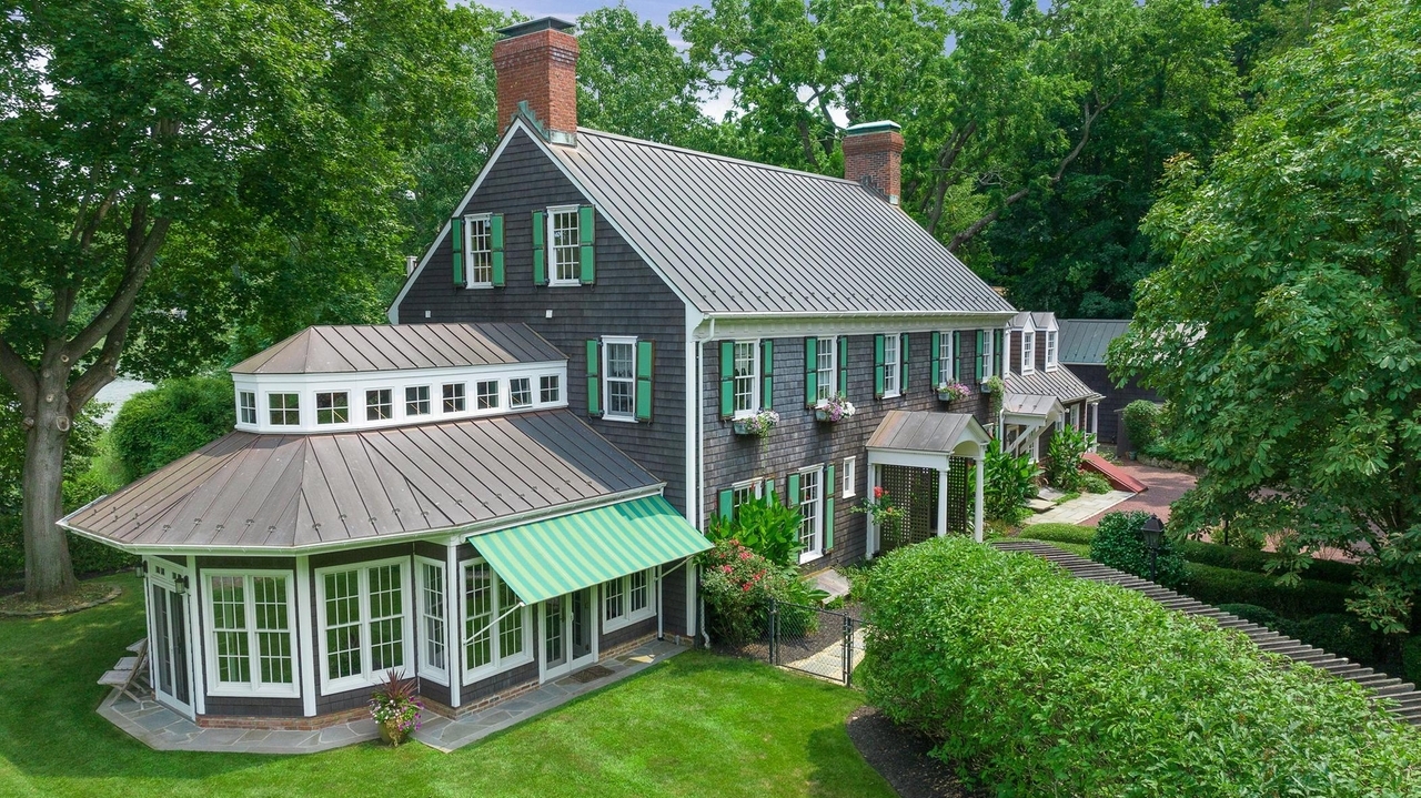 Riverfront Smithtown estate has guest cottage, wine cellar ...