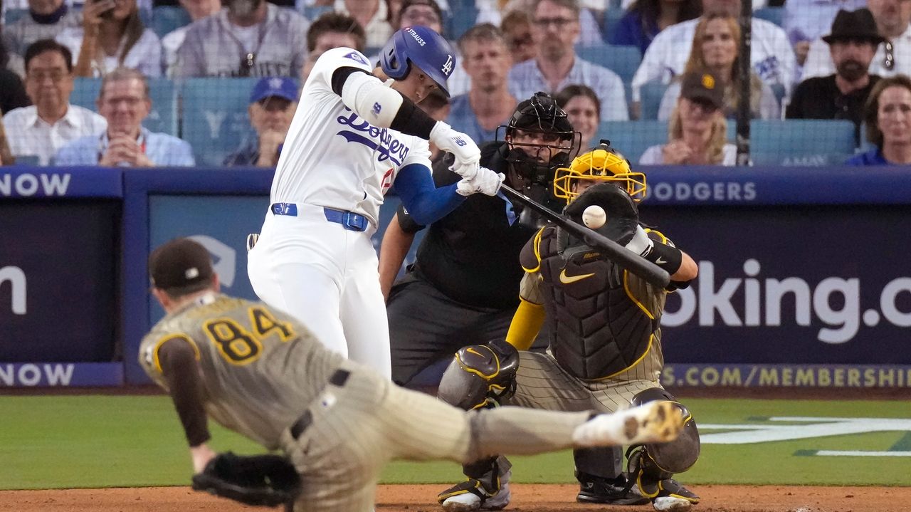 Ohtani homers in playoff debut and the Dodgers rally to beat the Padres ...