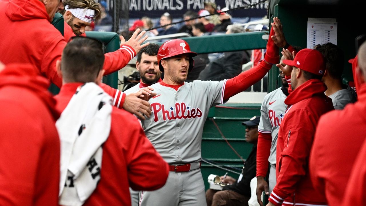 Realmuto homers after an intentional walk to Harper to help Phillies ...
