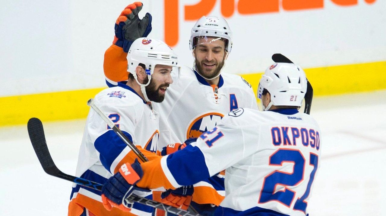 Islanders score three goals in third period to beat Senators in Travis ...