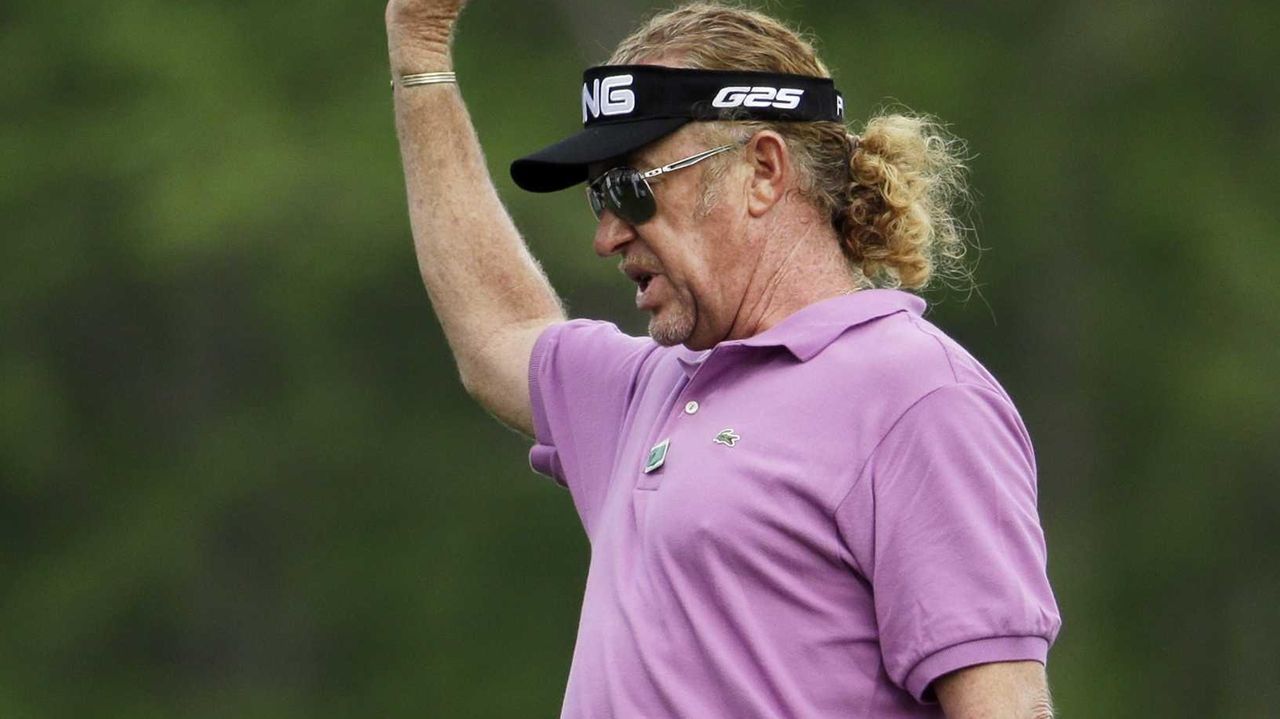 Miguel Jimenez, at 50, shows the youngsters something at Masters - Newsday