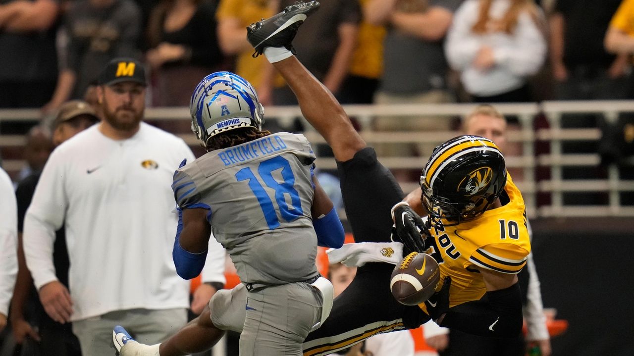 Luther Burden III hauls in 10 passes for 177 yards to help Missouri beat Memphis 34-27 in St ...