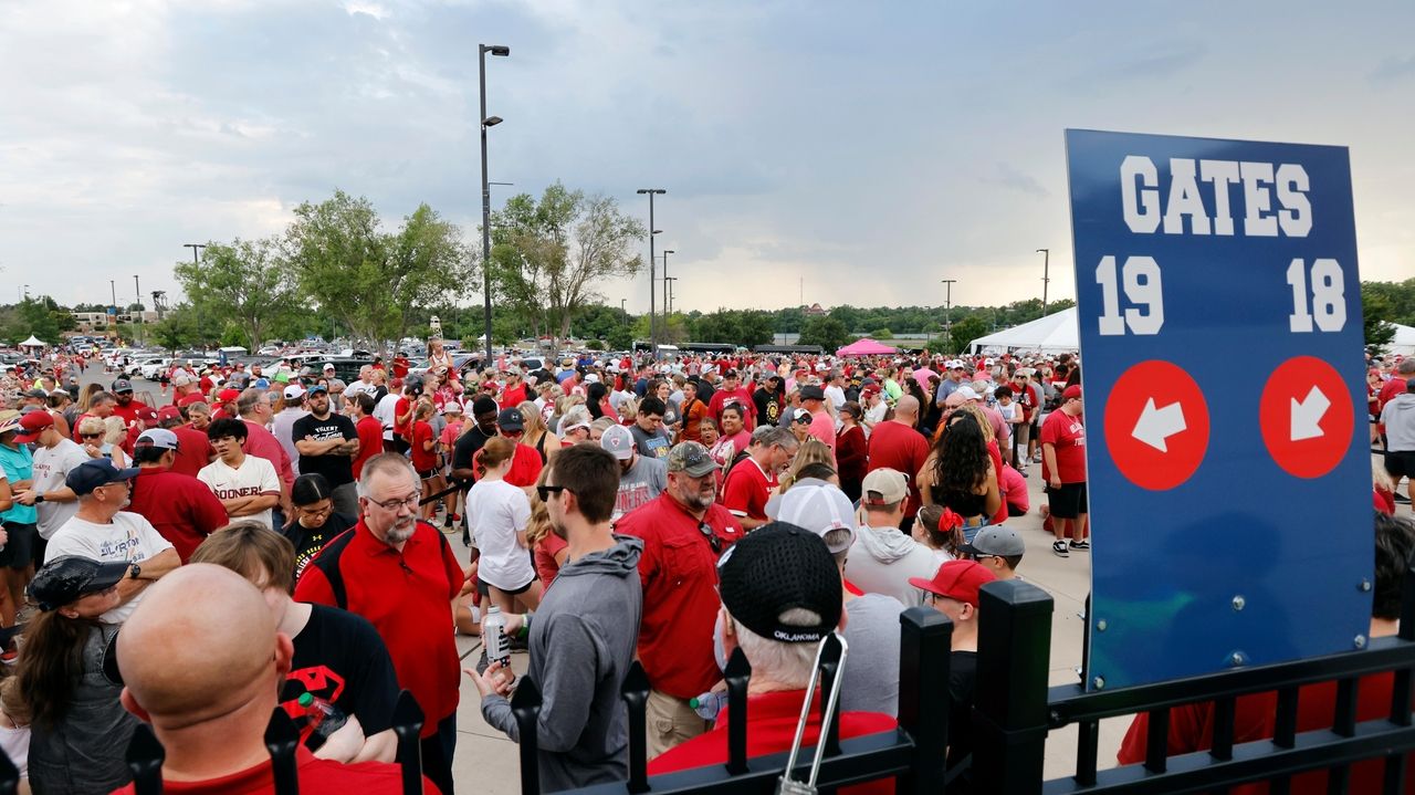Lightning delays slow action at the Women's College World Series - Newsday