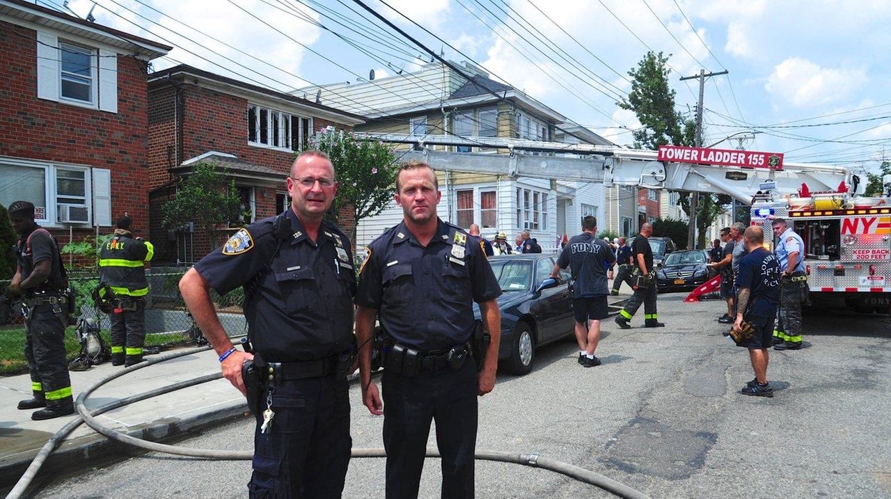 NYPD: Cops rescue woman, grandson from Queens house fire - Newsday