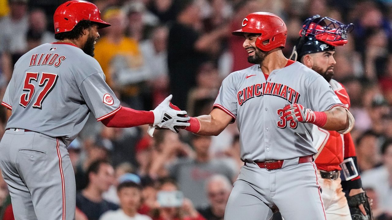 Encarnacion-Strand hits his 1st career grand slam to power Reds' rally ...