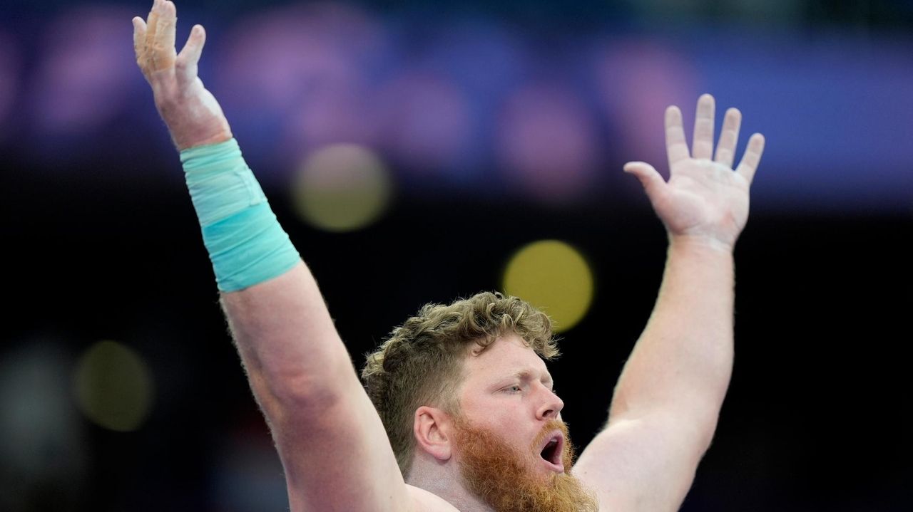 Ryan Crouser overcomes bothersome elbow to win 3rd straight Olympic shot put gold medal - Newsday