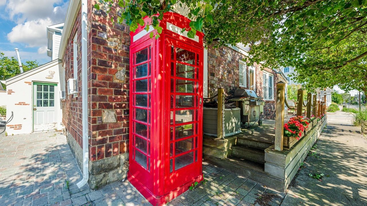 $1.1M Point Lookout home has London phone booth shower - Newsday