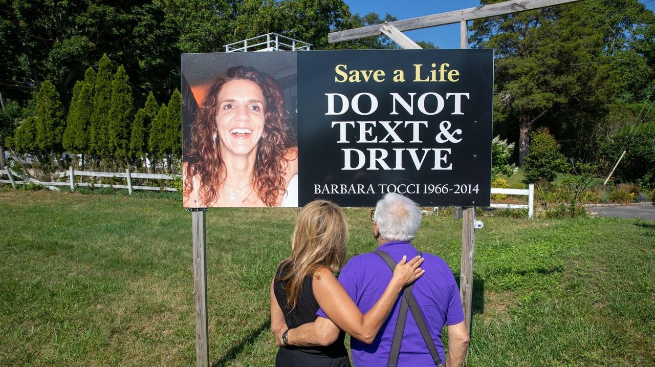 Signs honoring loved ones, warning about distracted driving pit family ...
