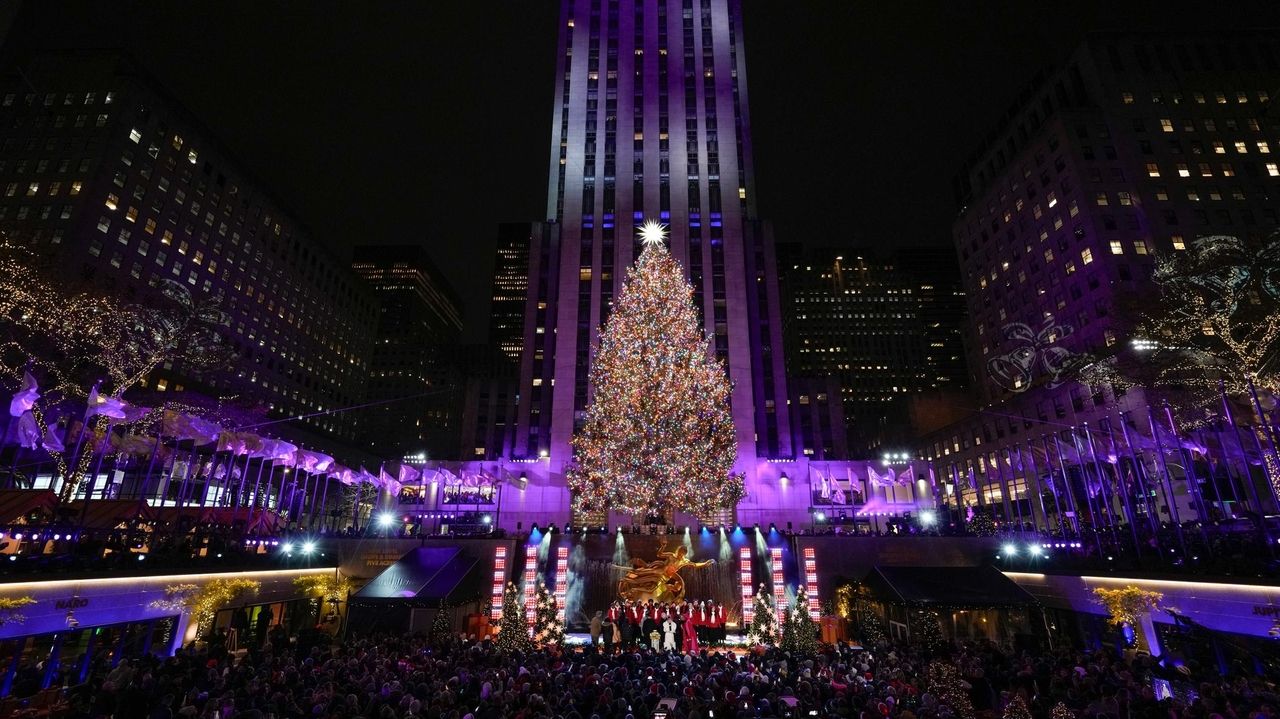 Iconic Christmas tree at Rockefeller Center illuminated in midst of pro ...