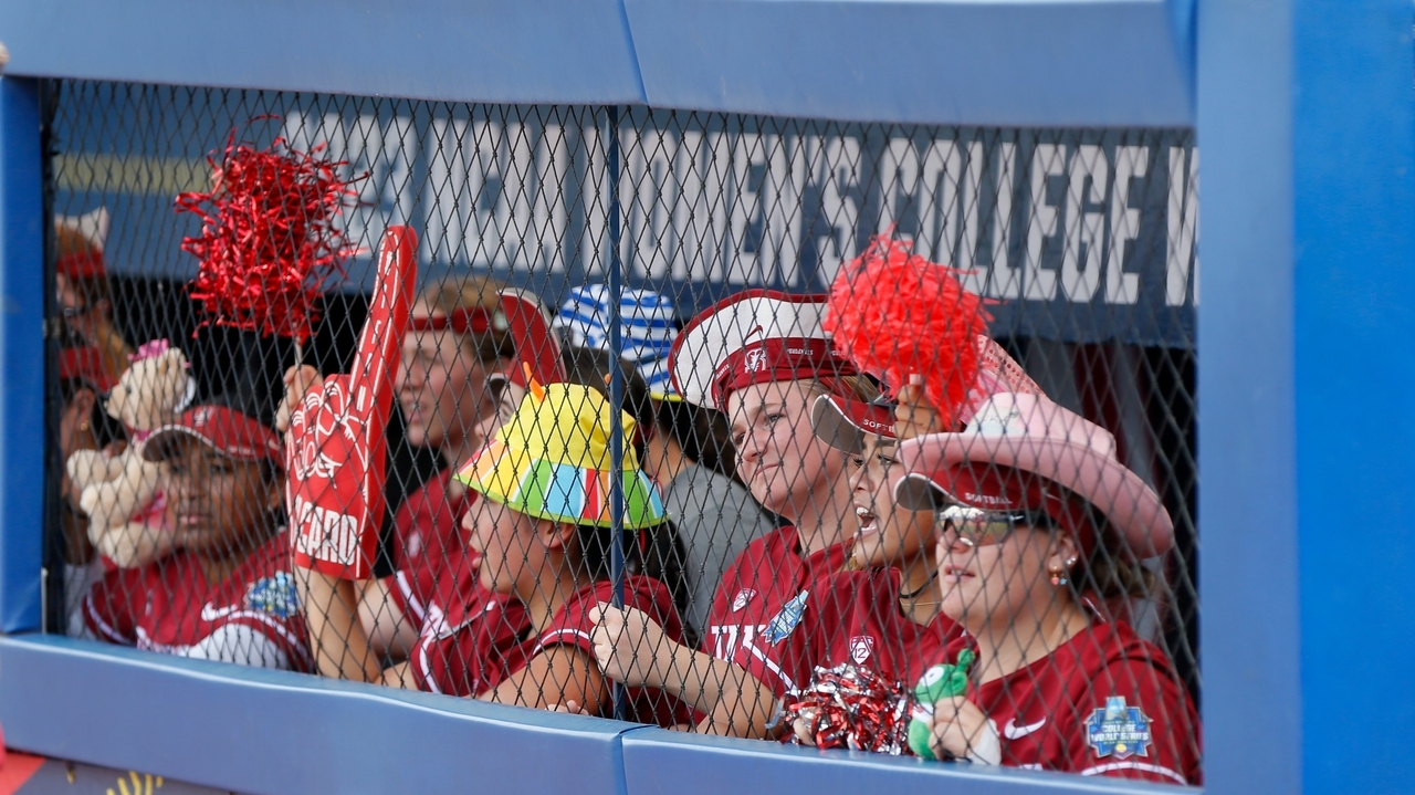College softball players bring light-hearted cheers to the dugout, in ...