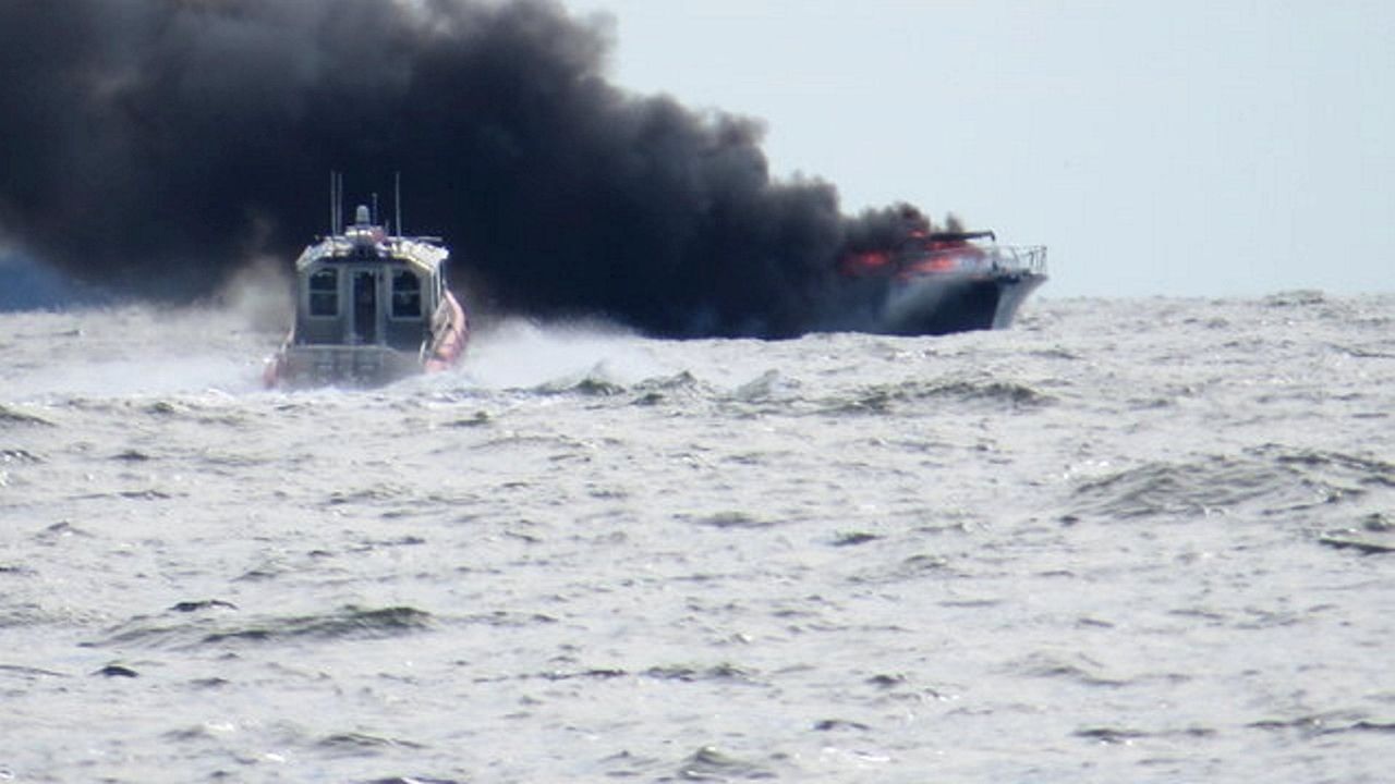 Man rescued after jumping into water when his boat catches fire in ...