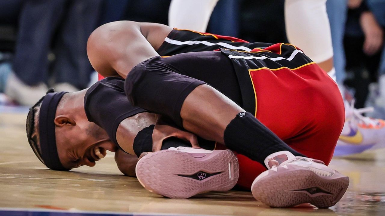 Heat's Jimmy Butler hurts ankle late but makes his presence known - Newsday