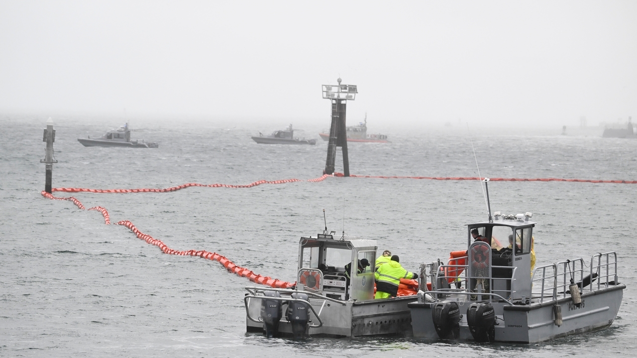 Navy crew members eject from their jet before it crashes off the San ...