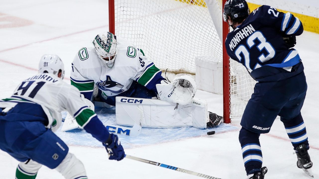 Jets beat Canucks 4-2 in the regular-season finale for the playoff ...