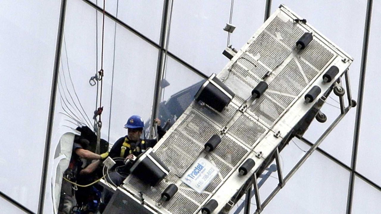 Investigators examine rescued window washers' rig - Newsday