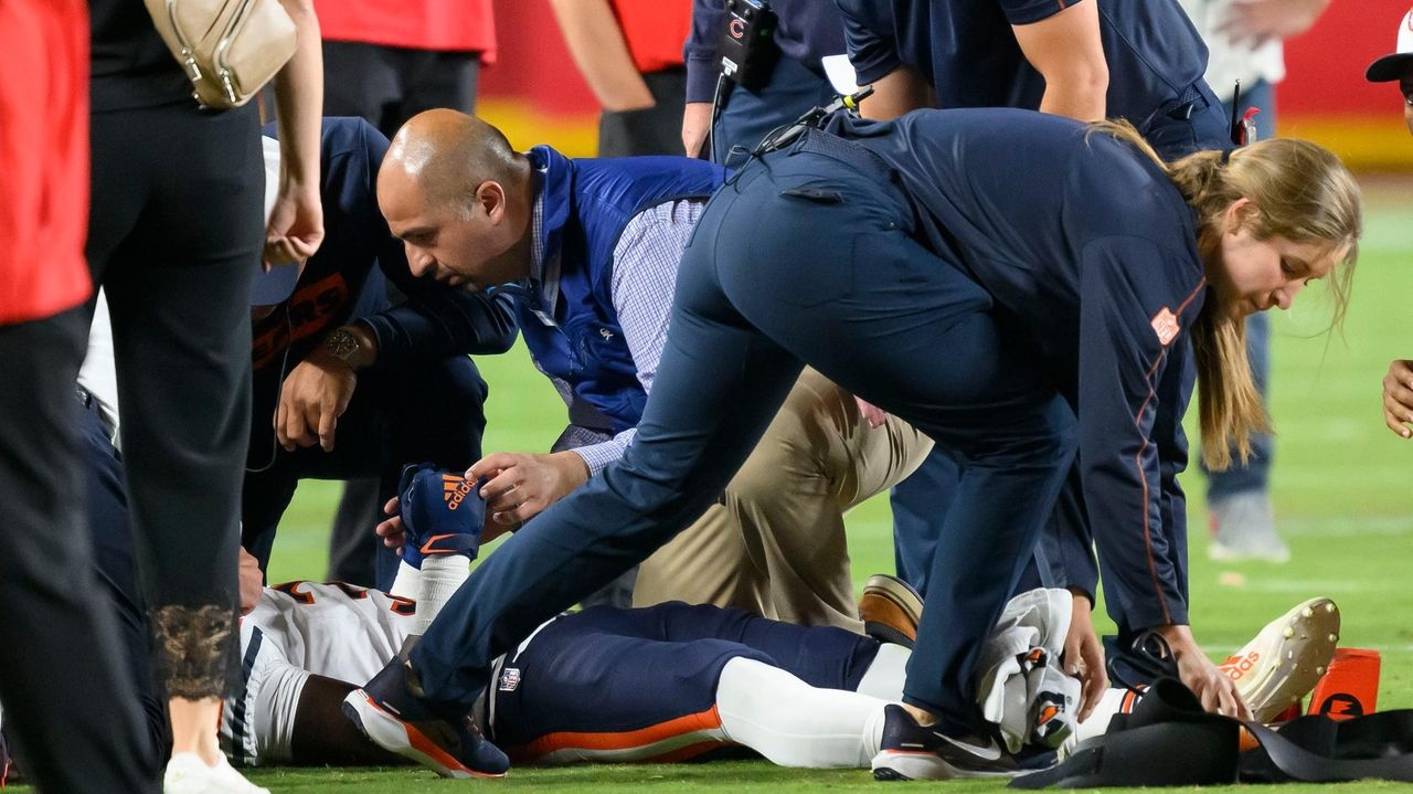 Bears' Douglas Coleman III immobilized, taken from field on stretcher ...
