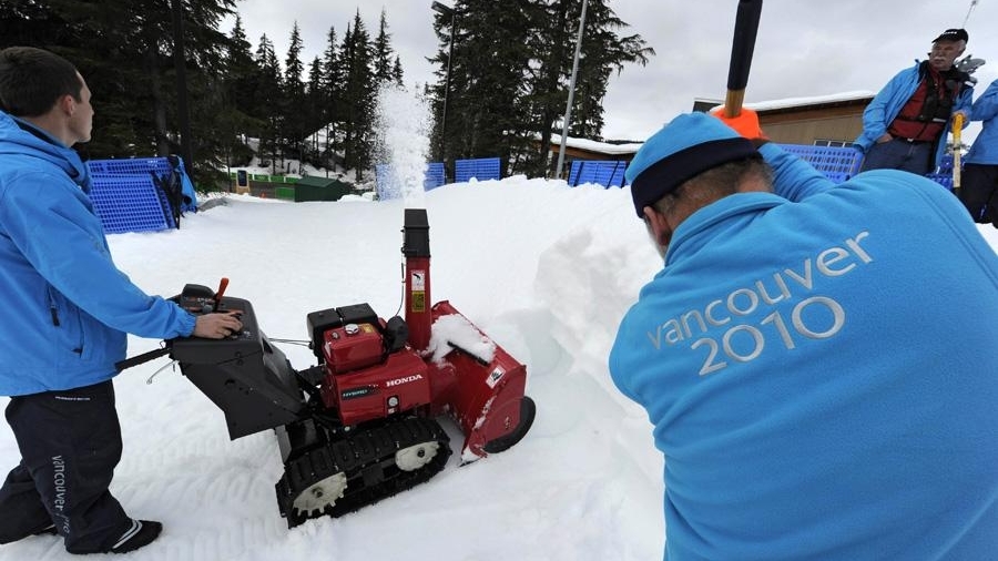 Workers bring in snow to ready Olympic ski course - Newsday