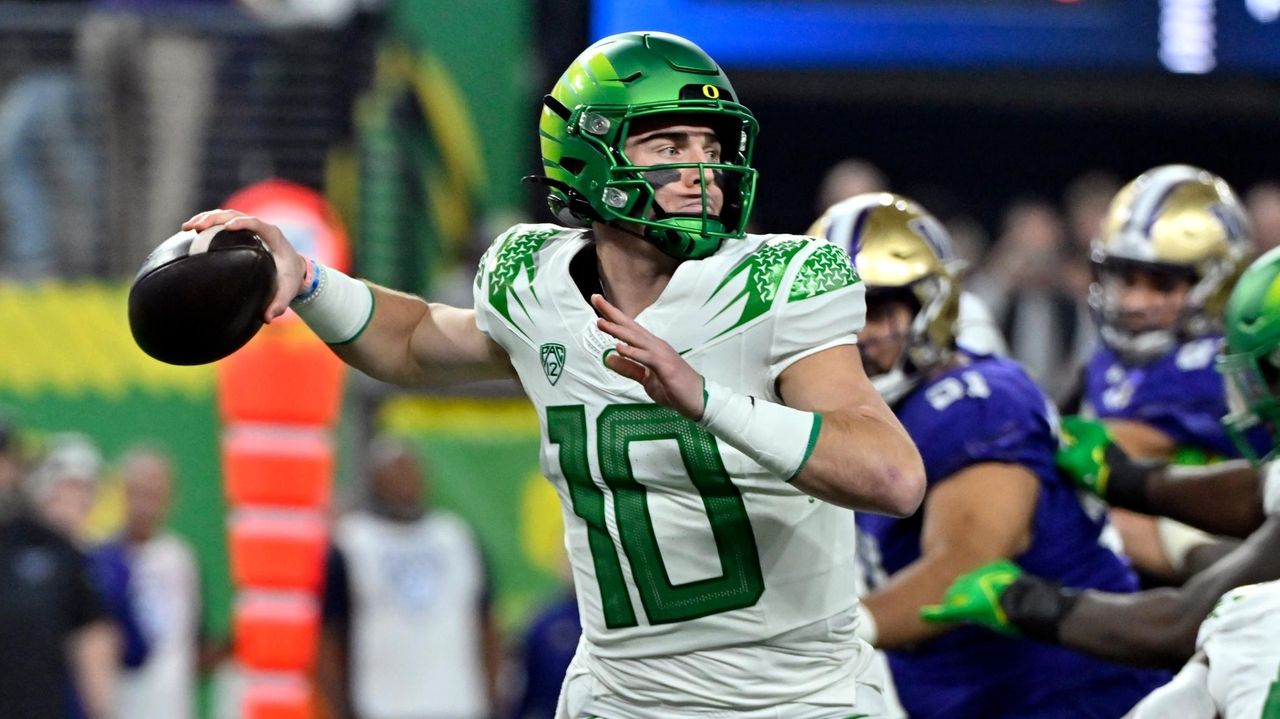 Oregon quarterback Bo Nix dejected after loss in Pac-12 championship, mum on status for bowl ...