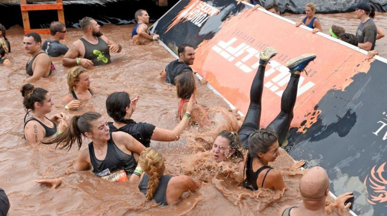 Tough Mudder at Old Bethpage Village Restoration includes mud, rain and ...